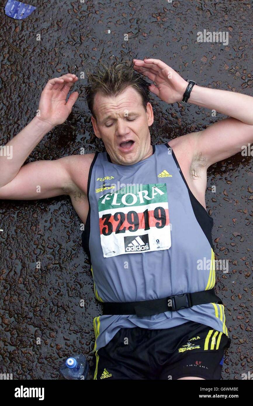 Celebrity chef Gordon Ramsay reclines after crossing the finish line in ...