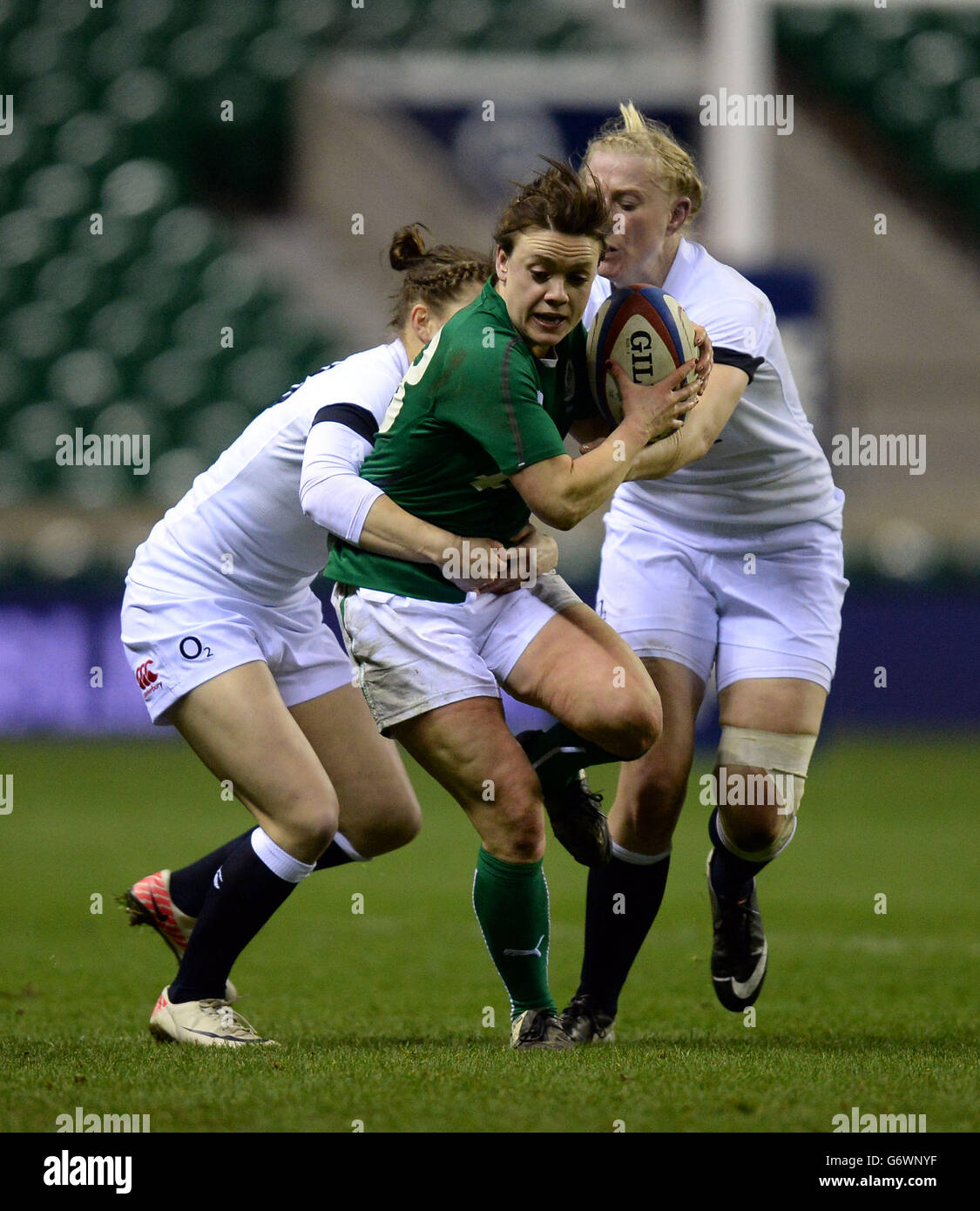 Ireland's Lynne Cantwell (centre) is tackled by England's Tamara Taylor ...