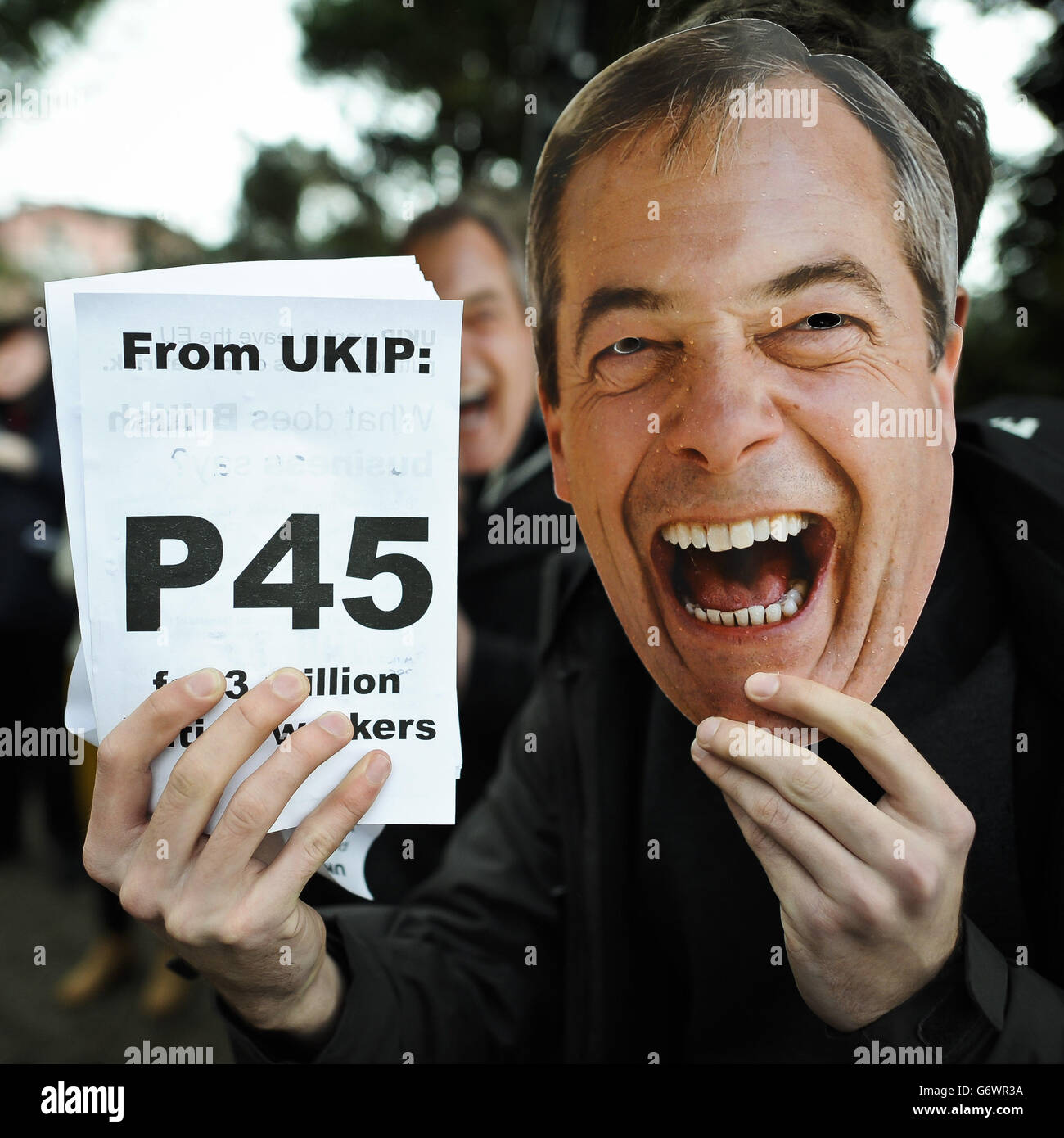 People wear UKIP leader Nigel Farage masks at the UKIP Spring ...