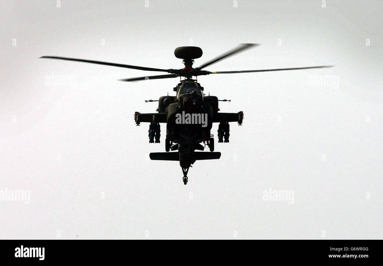 An Apache attack helicopter takes off from HMS Ocean in the Bristol ...