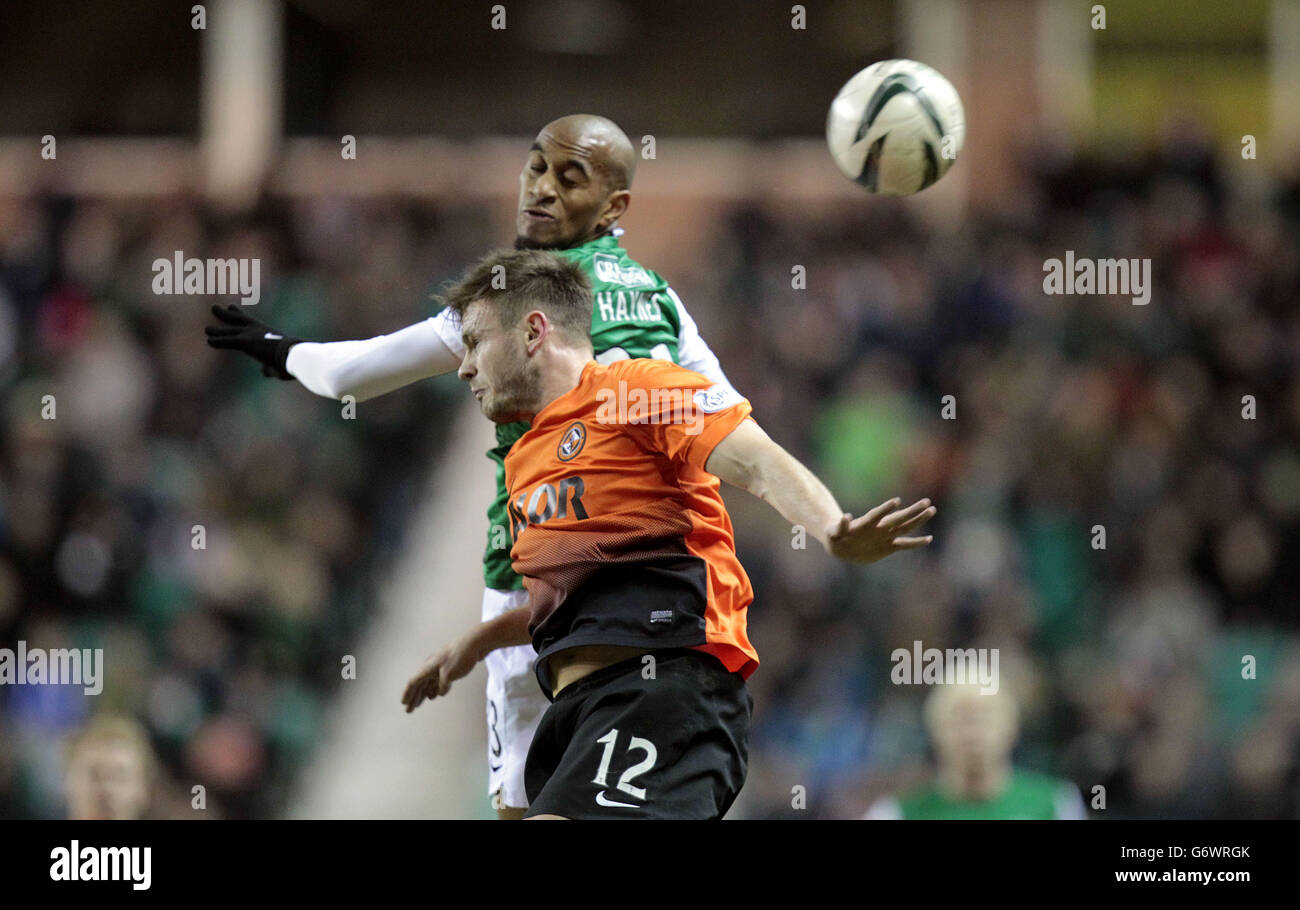 Hibernian's Danny Haynes (top) vies with Dundee United's Keith Watson ...