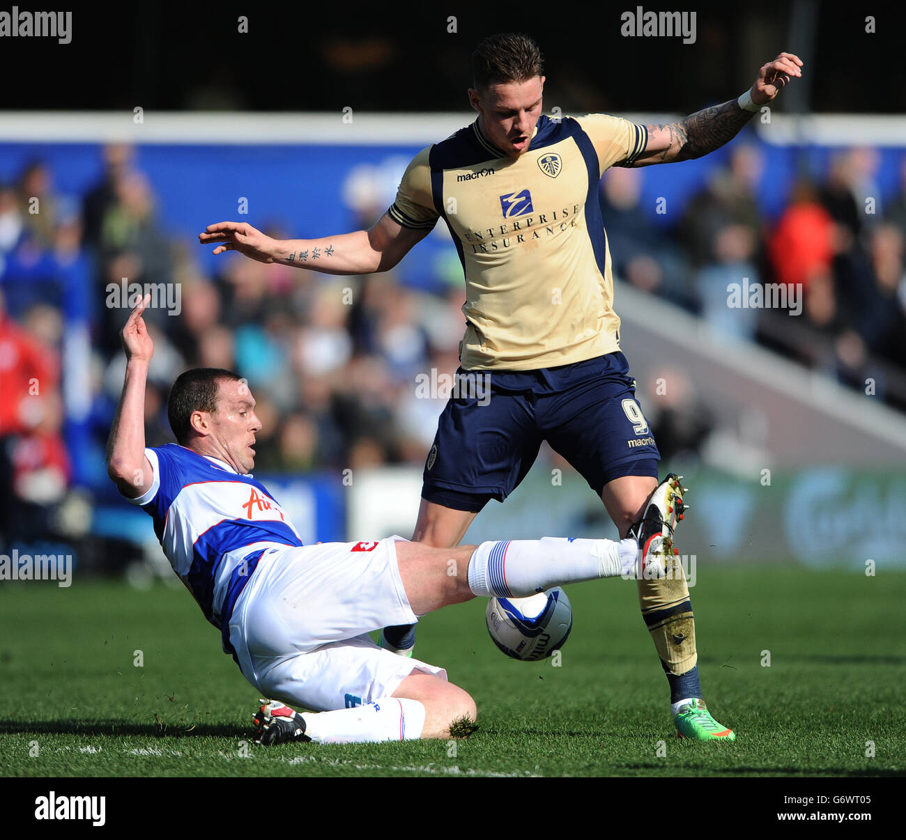 Queens Park Rangers' Richard Dunne and Leeds United's Connor Wickham ...
