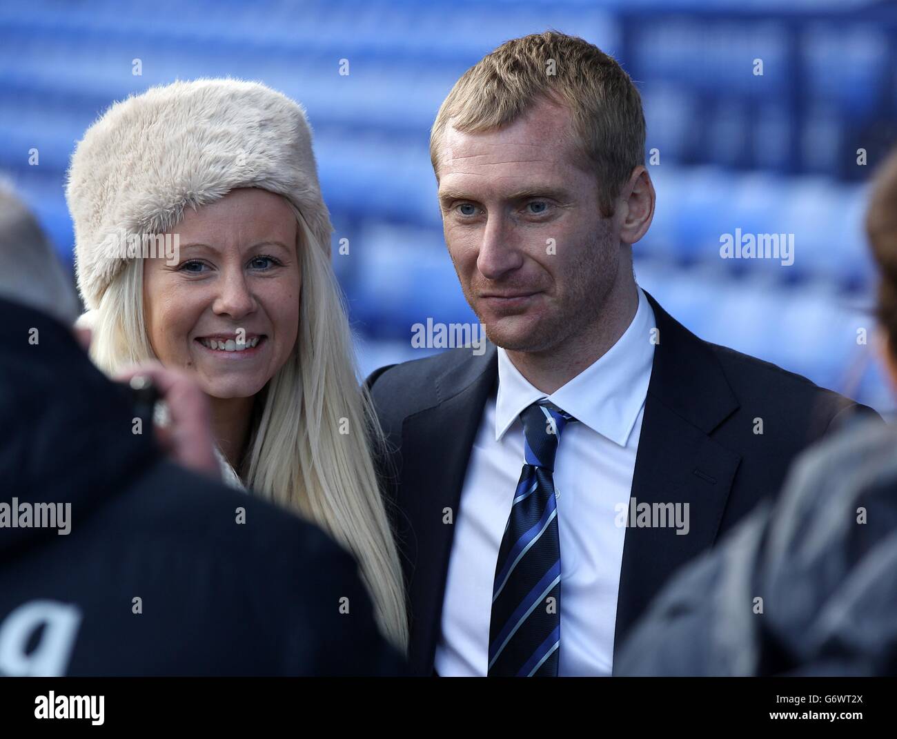 Everton's Tony Hibbert poses for a picture with a fan Stock Photo - Alamy