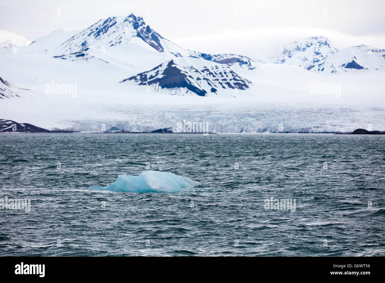 Floating sea ice near a massive glacier in the arctic Stock Photo - Alamy