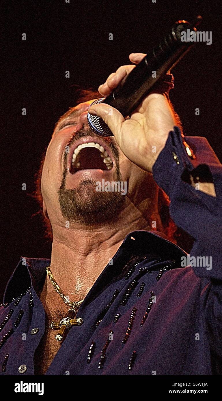 Celebrity music head shoulders microphone singing on stage performing ...