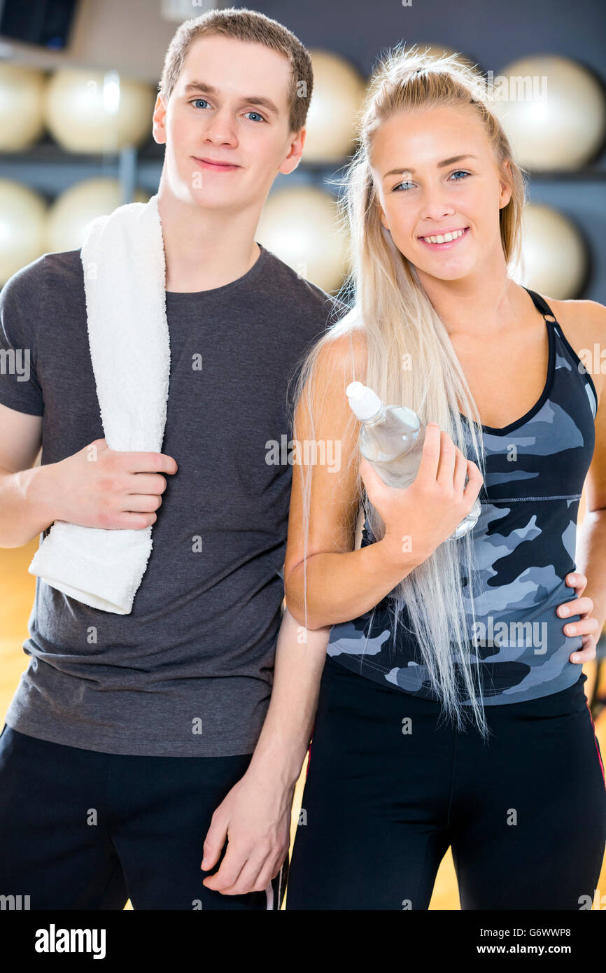 Portrait of two cheerful people having a break at gym Stock Photo - Alamy