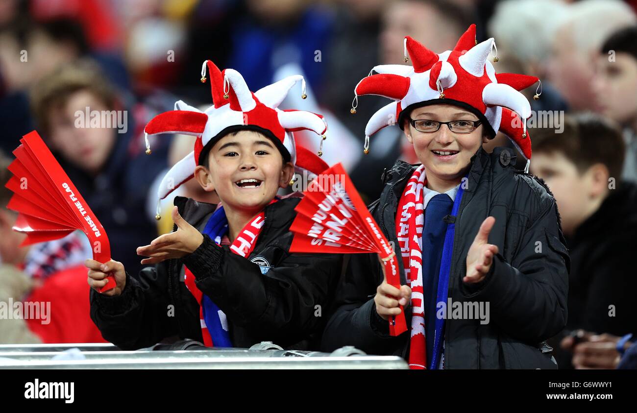 Young England fans show their support in the stands before the game ...