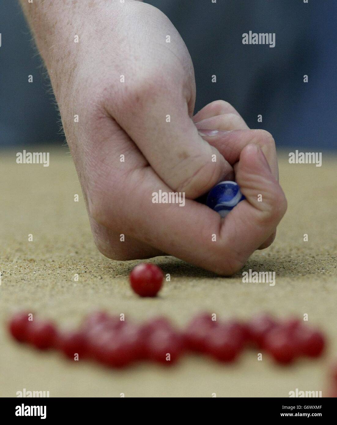A competitor lines up a shot at the World Marbles Championships held at ...