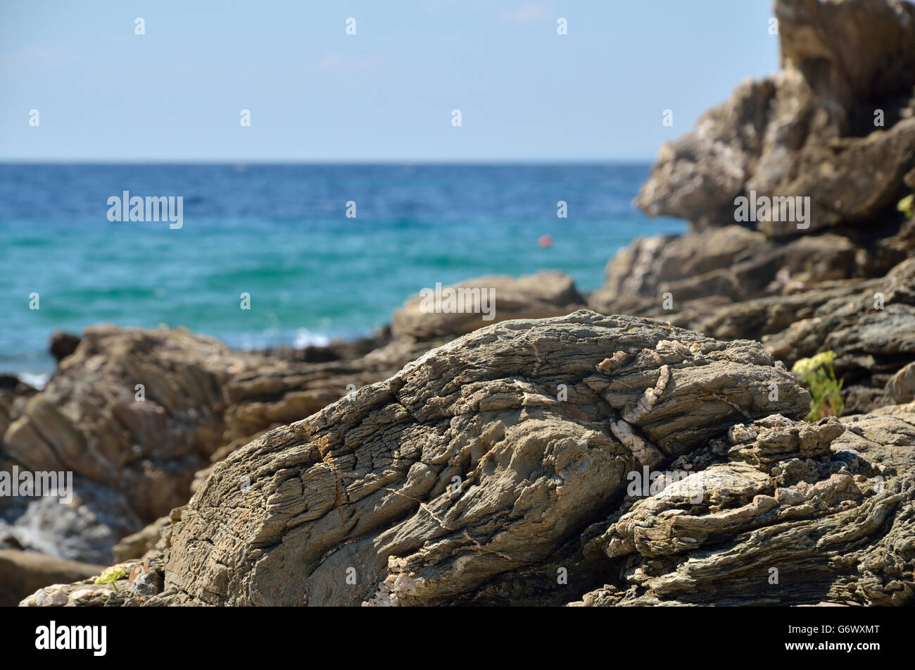 Rocks and turquoise sea water in background in summer time Stock Photo ...