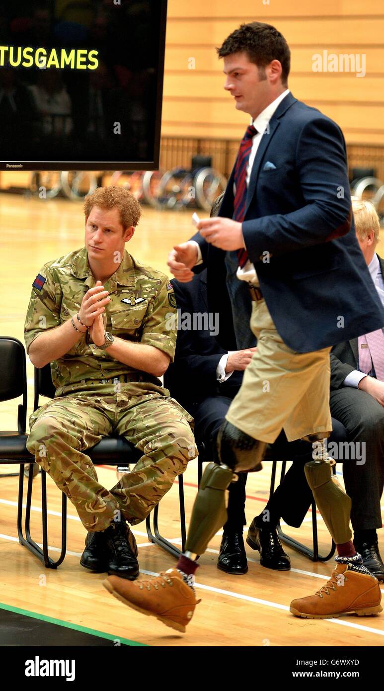 Prince Harry applauds as army veteran David Henson walks up to make his ...