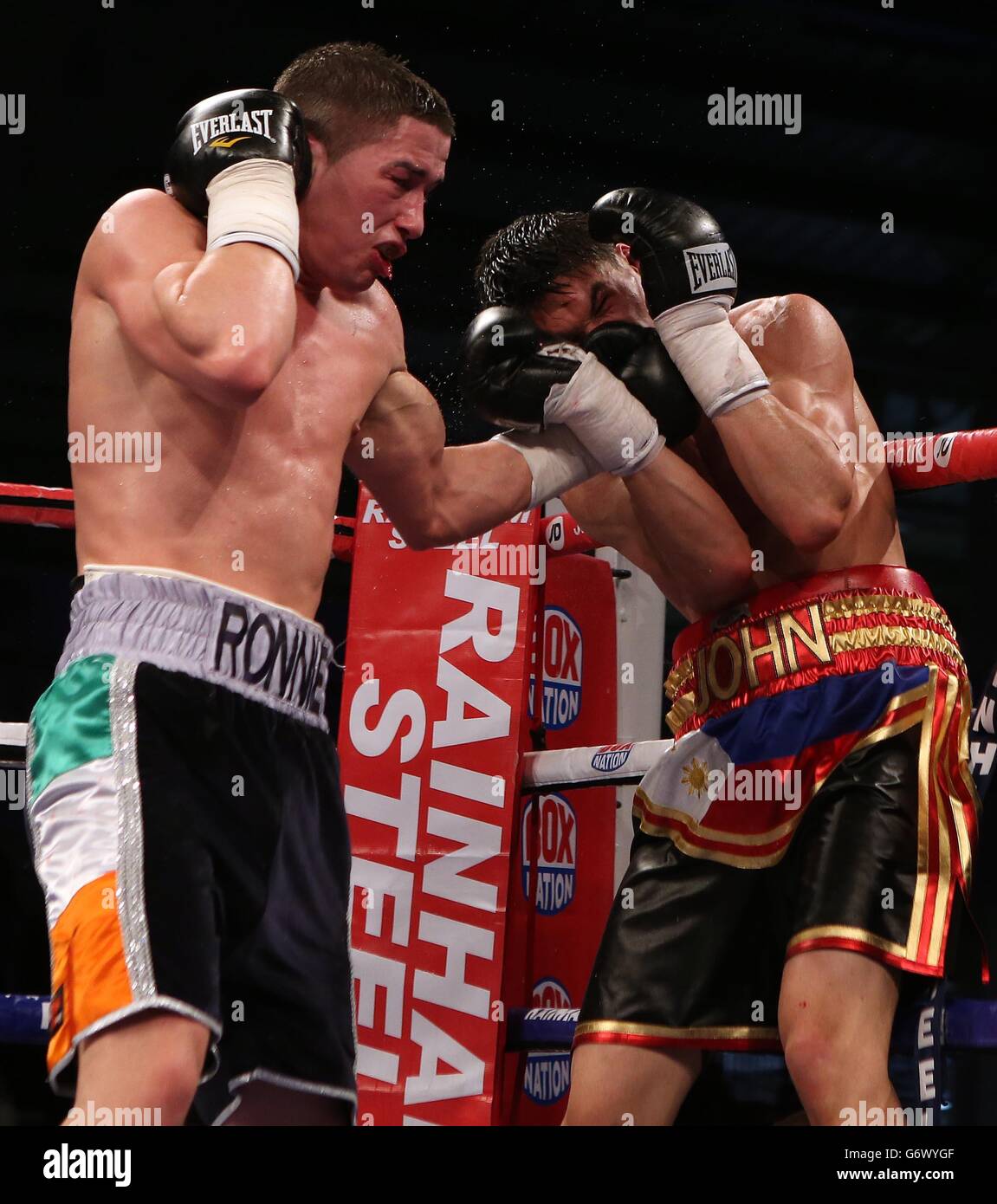 Ronnie Heffron (left) lands a punch on John Thain in their light ...