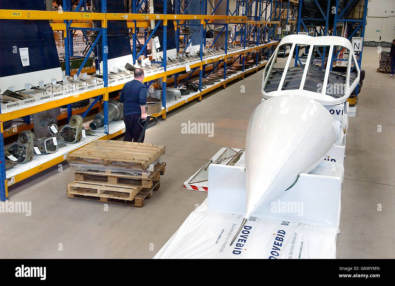 A Concorde nosecone and visor stand with other parts of the plane in ...