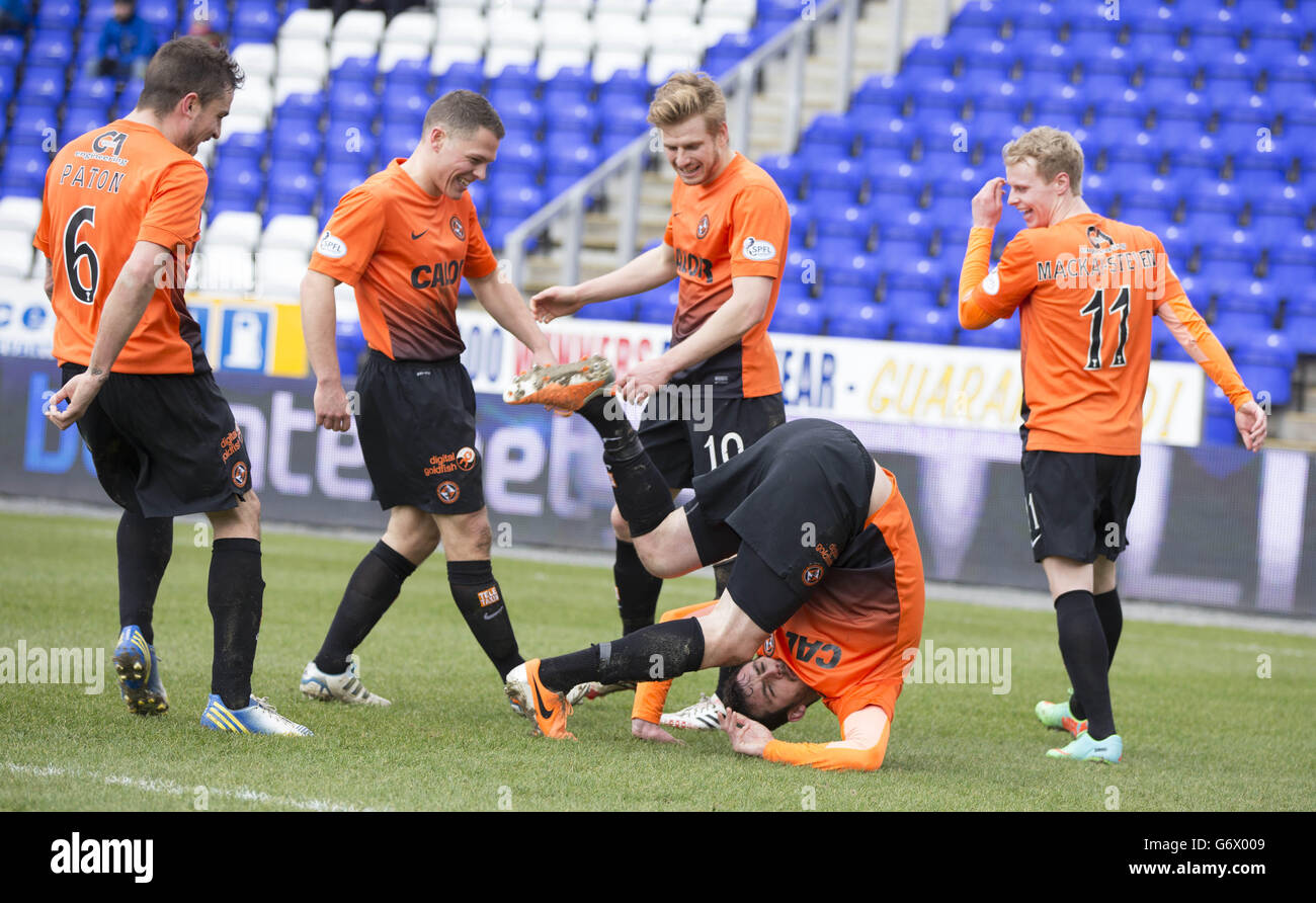 Dundee United's Gavin Gunning (on floor) celebrates scoring the third ...