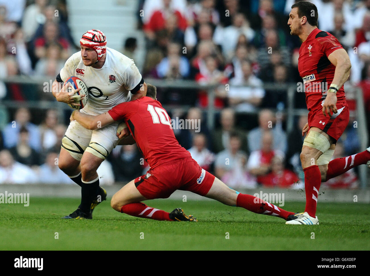 Englands ben morgan is tackled by wales rhys priestland hi-res stock ...