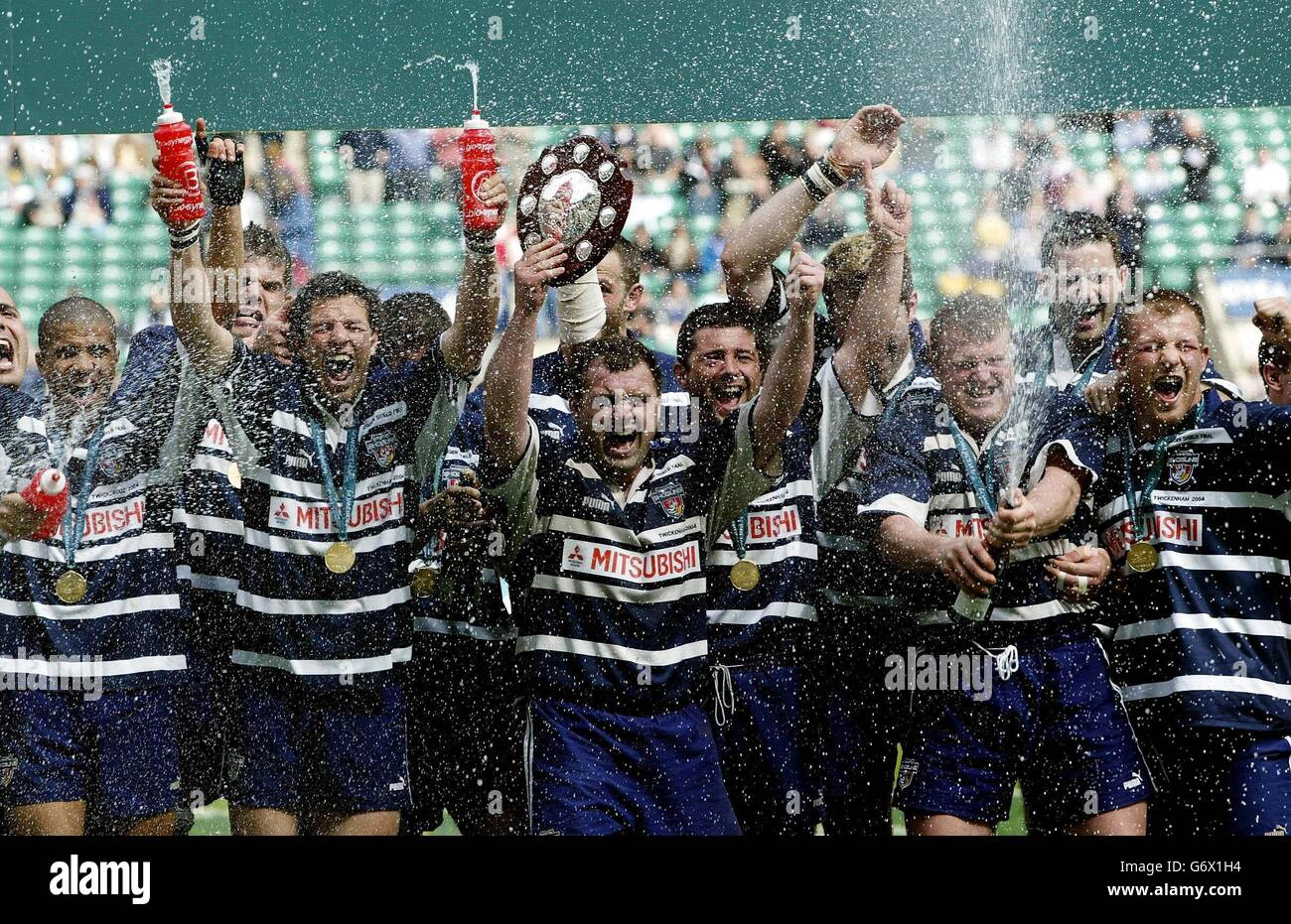 Bristol captain David Hilton leads his team's celebrations holding the ...