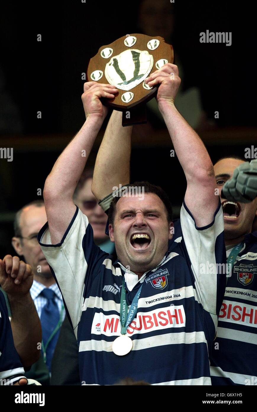 Bristol captain David Hilton leads his team's celebrations holding the ...