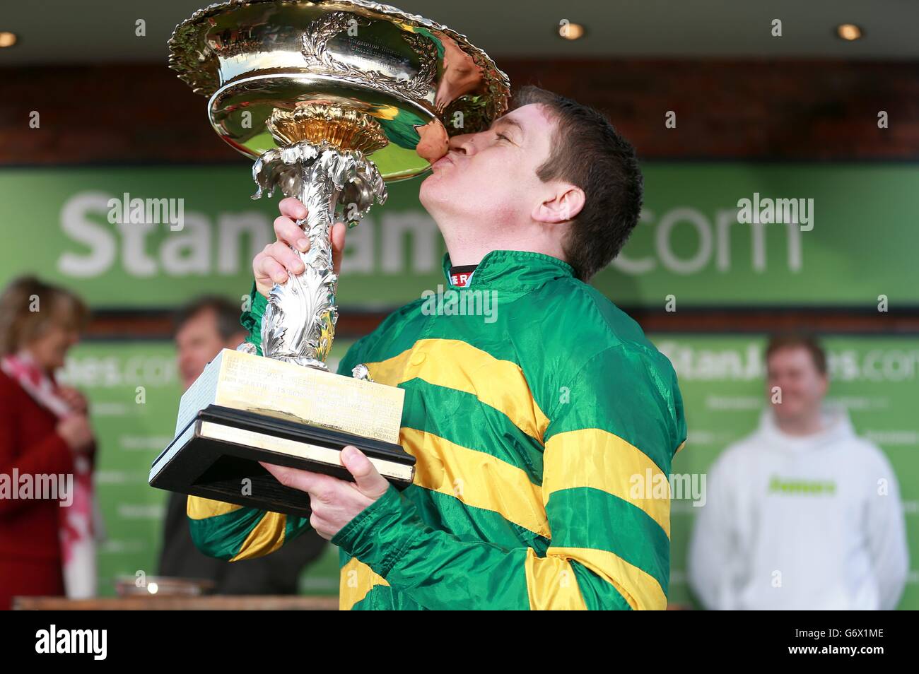 Jockey Barry Geraghty poses with the trophy after victory on board ...