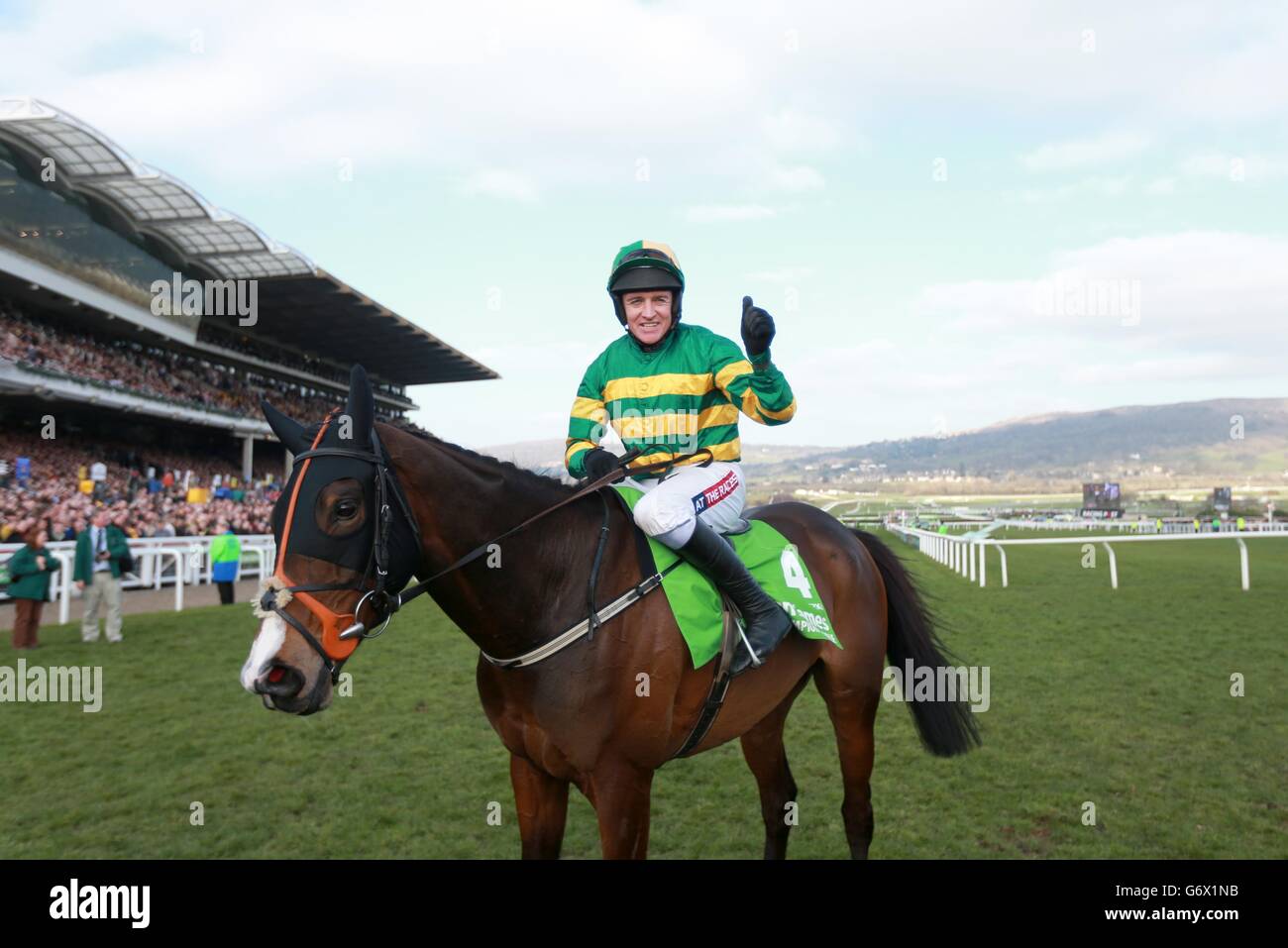 Jockey Barry Geraghty celebrates on Jezki following victory in the Stan ...