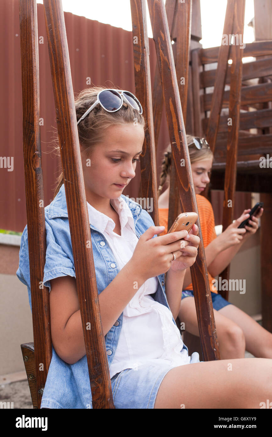 Teenagers with gadgets Stock Photo - Alamy