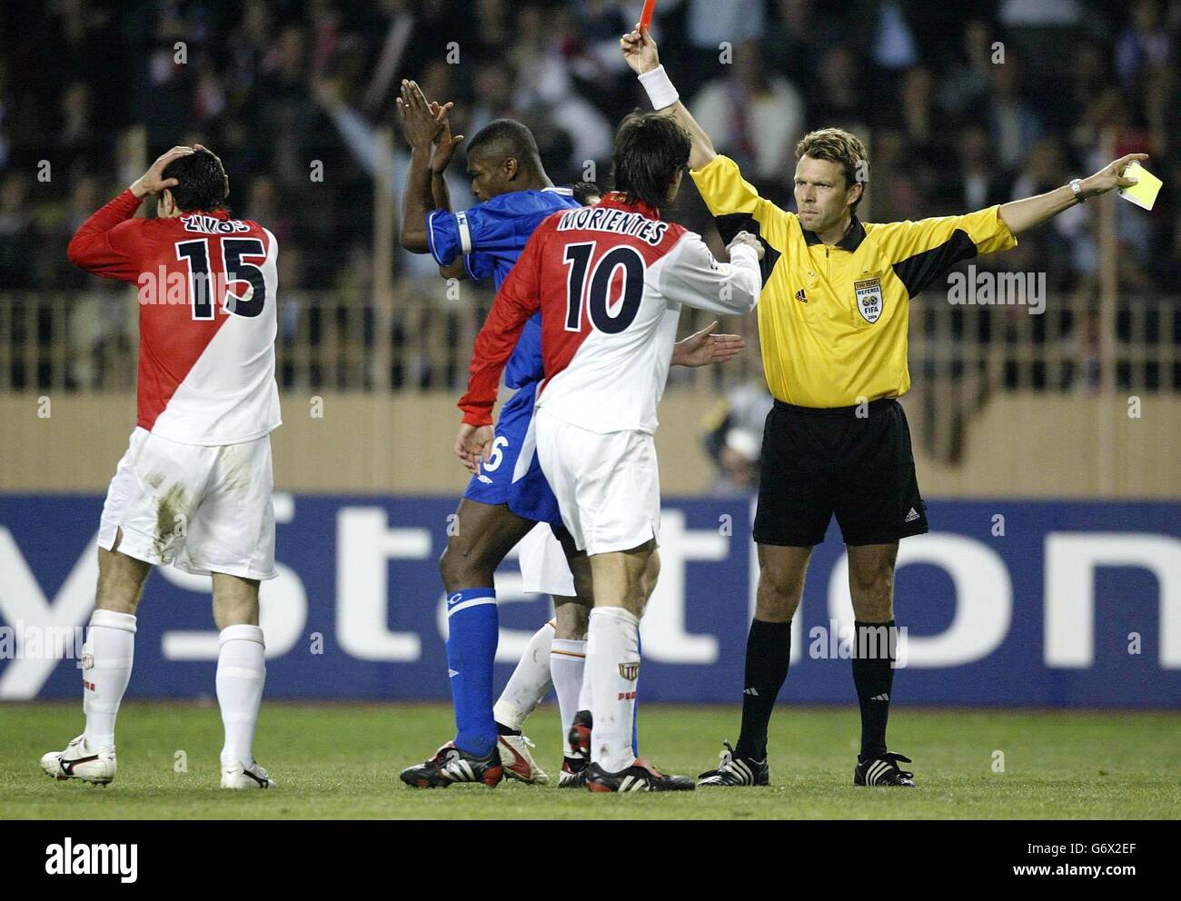 Monaco's Andreas Zikos (left) is sent off by referee Urs Meier after ...