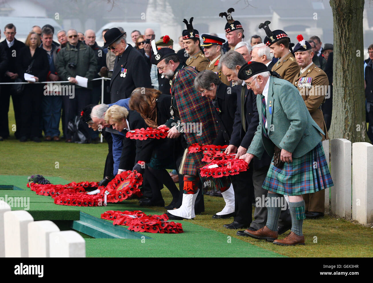 Members of the congregation lay wreaths at graves in the Commonwealth ...