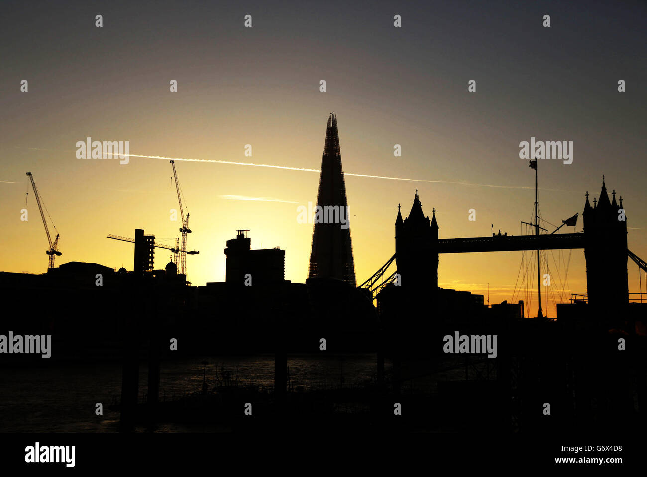 A view of The Shard building and Tower Bridge at sunset, in central ...