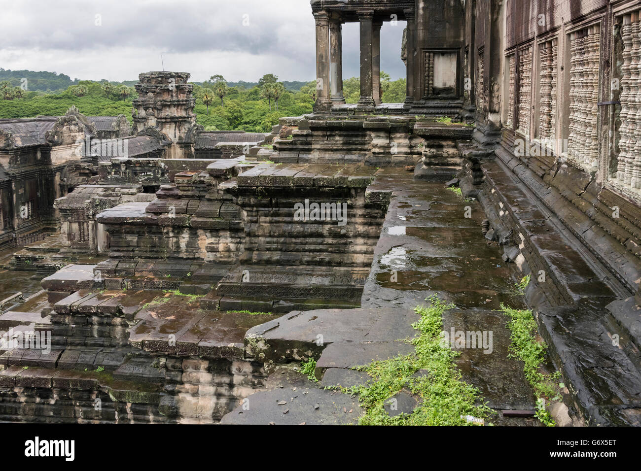 Massive stone structure of Angkor Wat seen from the upper terrace ...