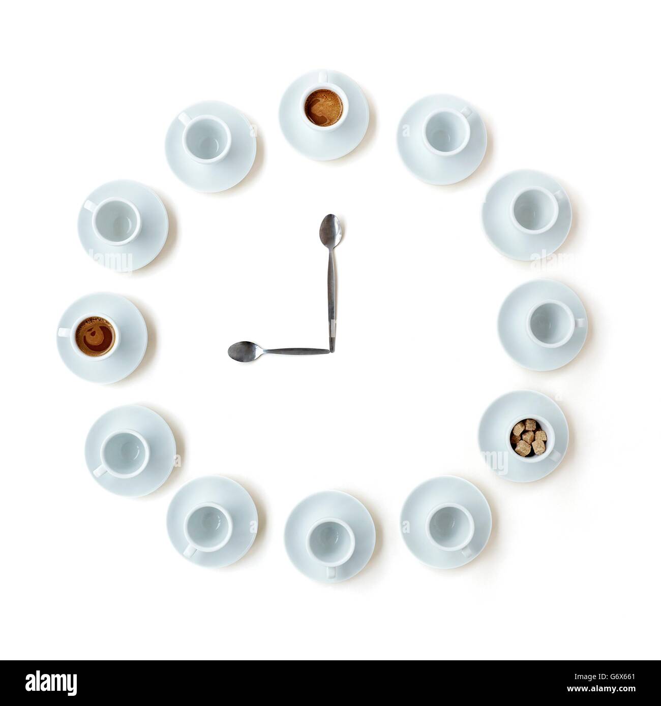 Coffee cups in he shape of a clock, studio shot Stock Photo - Alamy