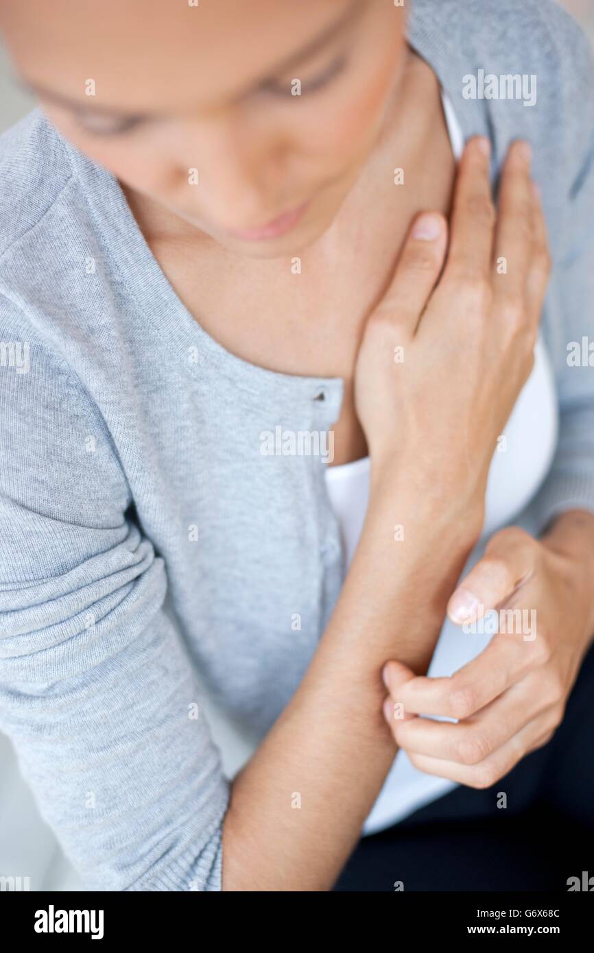 Woman scratching with discomfort hi-res stock photography and images ...