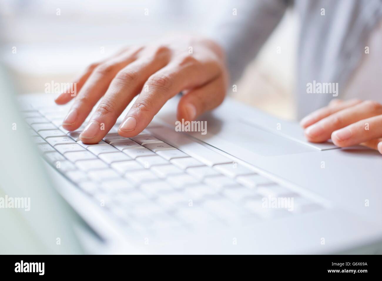 MODEL RELEASED. Woman using her laptop Stock Photo - Alamy