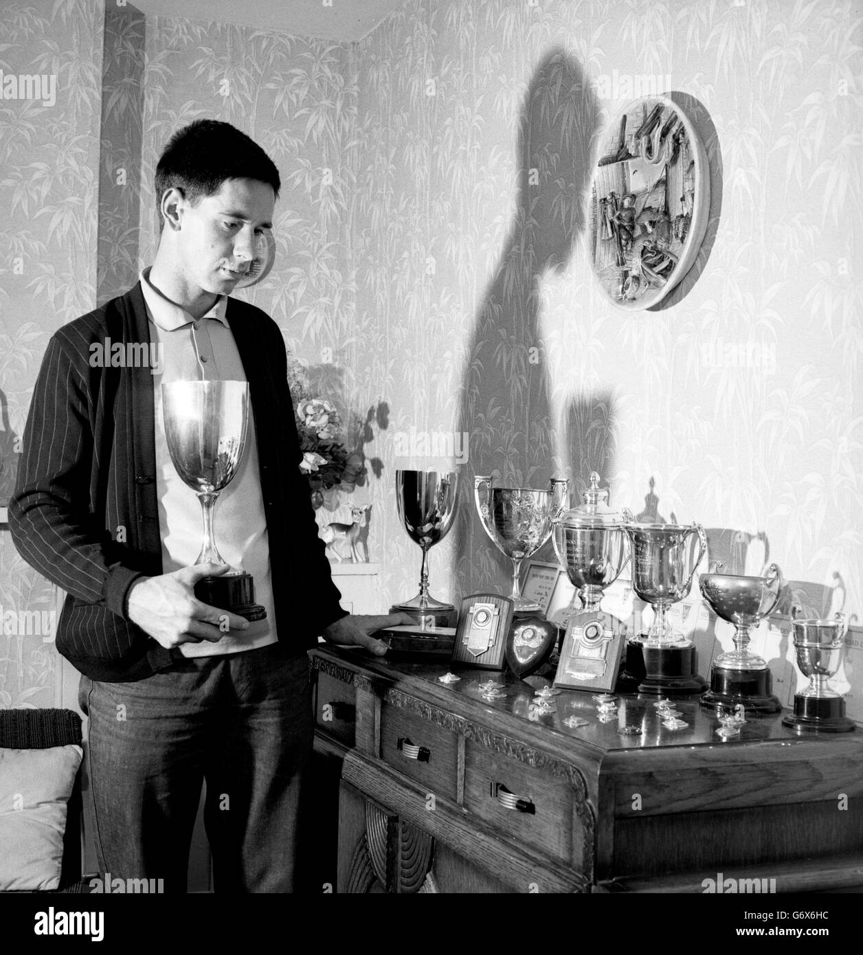 Colin Lewis, 22, with his collection of cycling trophies, at his home ...