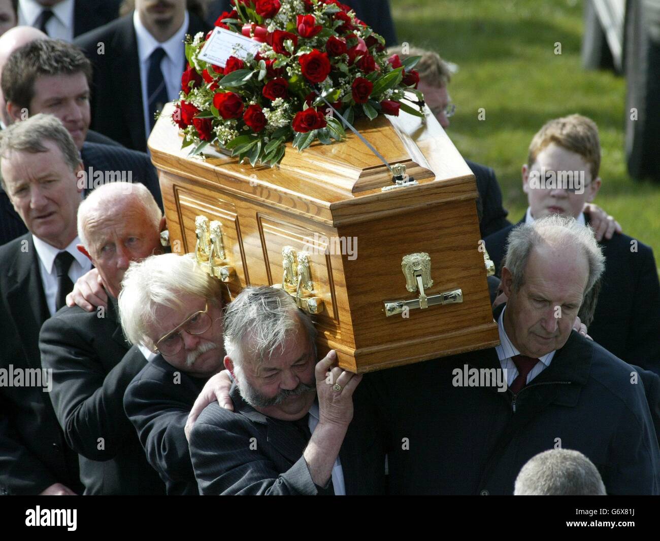 The coffin of Portadown Orange Order leader Harold Gracey makes its way ...