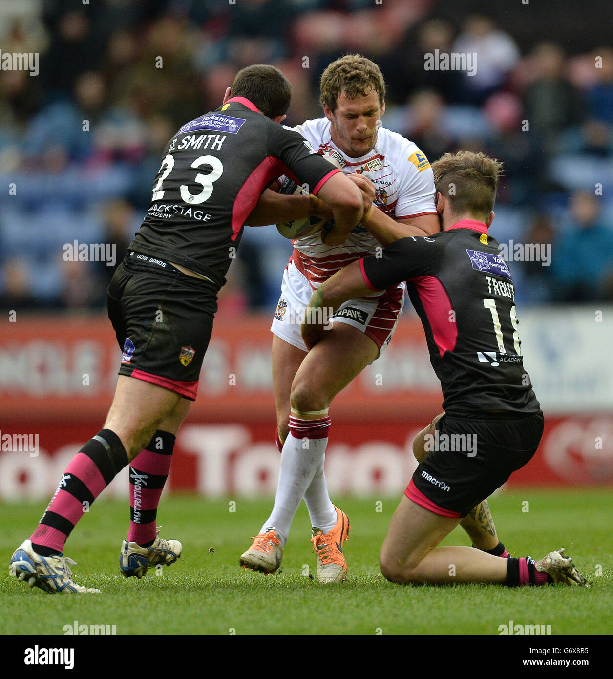 Wigan Warriors Sean O'Loughlin is tackled by Wakefield Trinity Wildcats ...