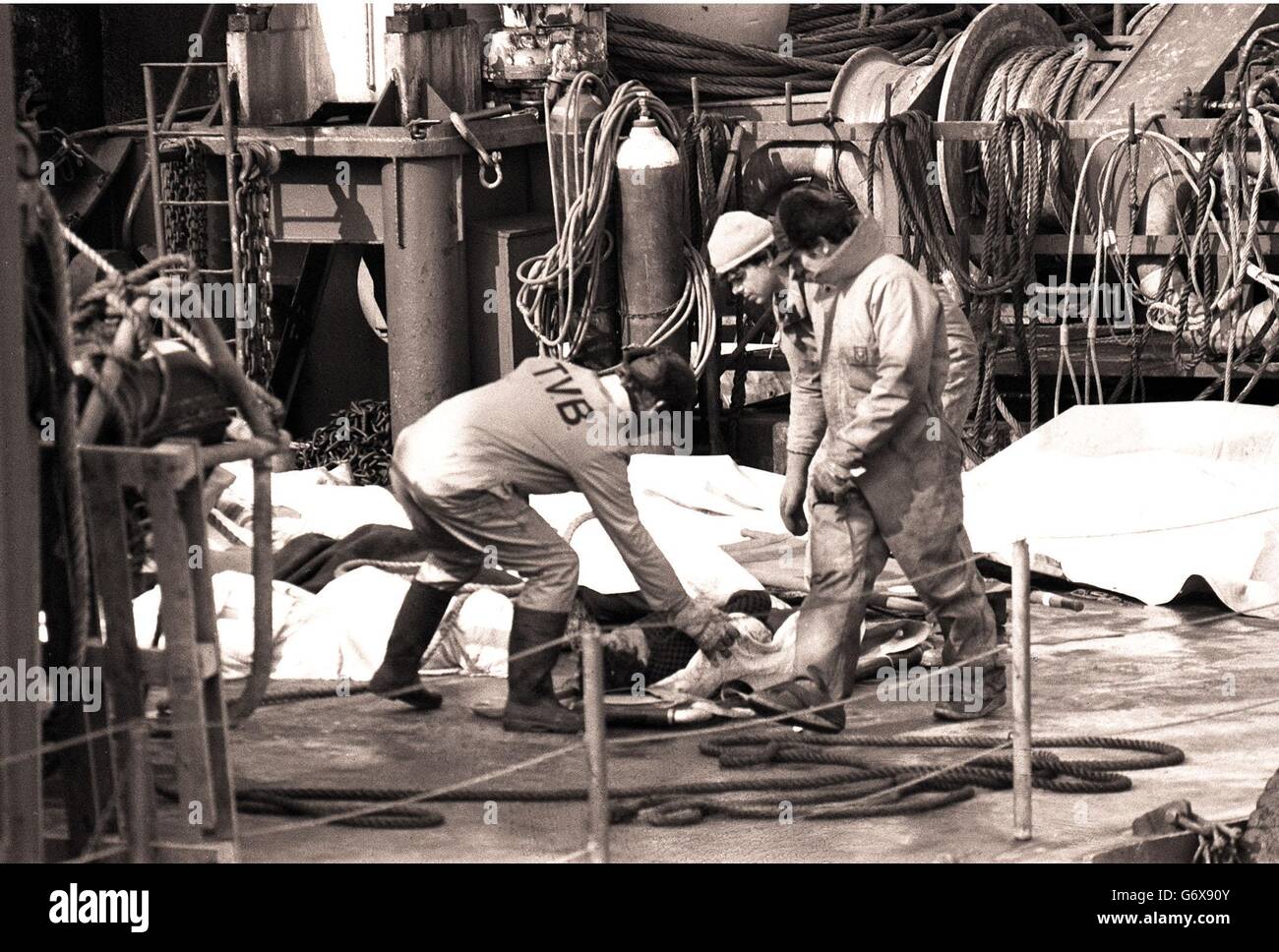 Rescue workers cover some bodies recovered capsized car ferry hi-res ...