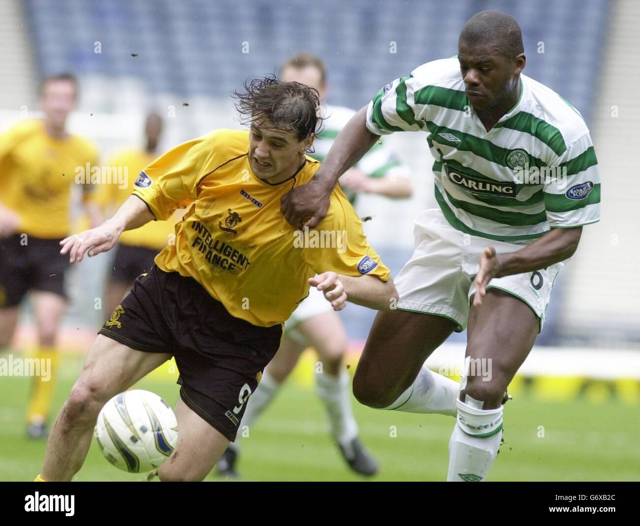 Celtic's Bobo Balde challenges Livingston's Fernando Pasquinelli during ...