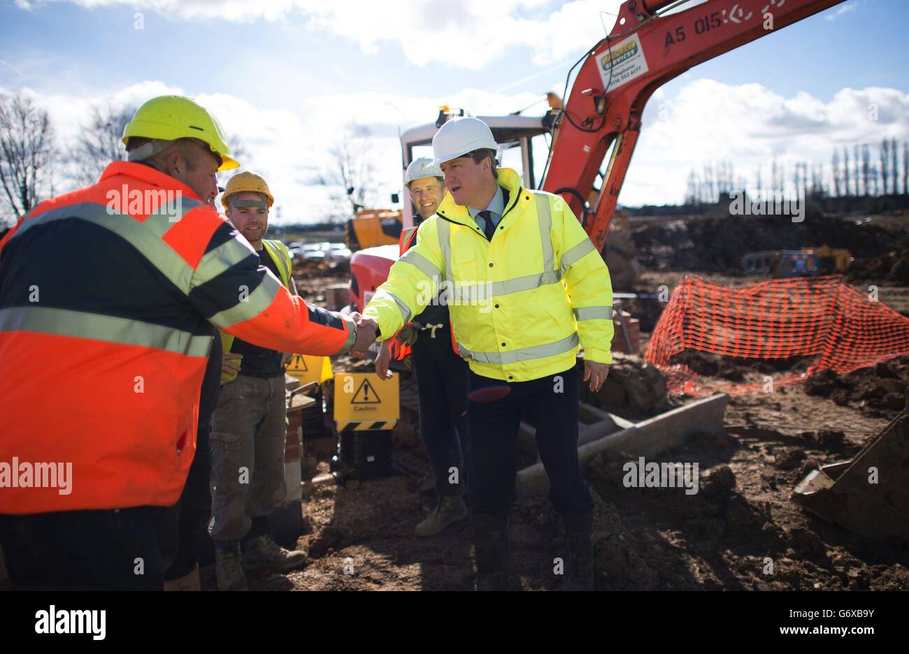 Prime Minister David Cameron meets workers at the Woodlands housing ...