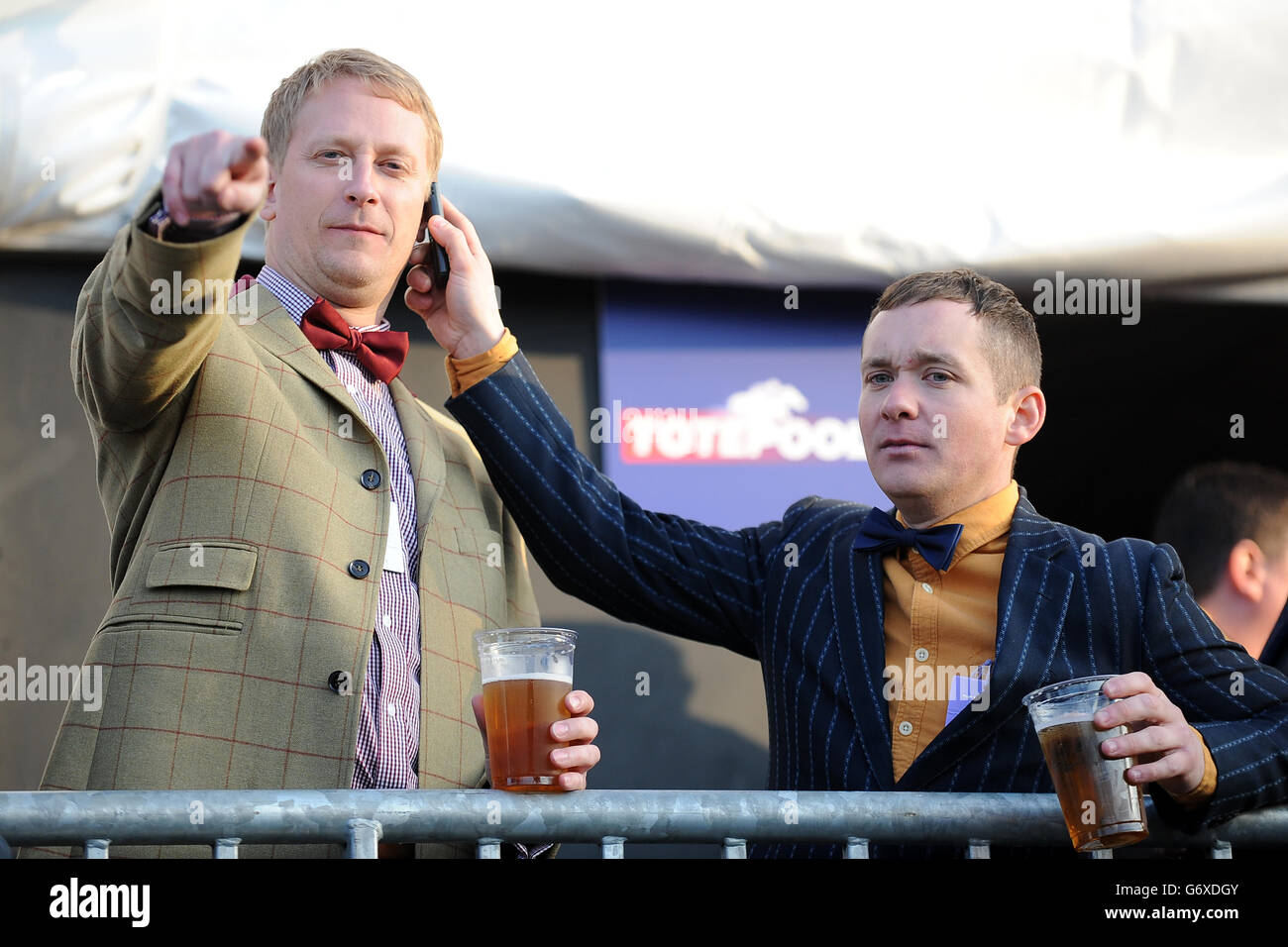Spectators enjoy a drink inside the Guinness Village on Day One of ...