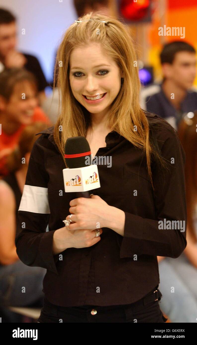 Canadian singer Avril Lavigne wears a large ring on her engagement ...