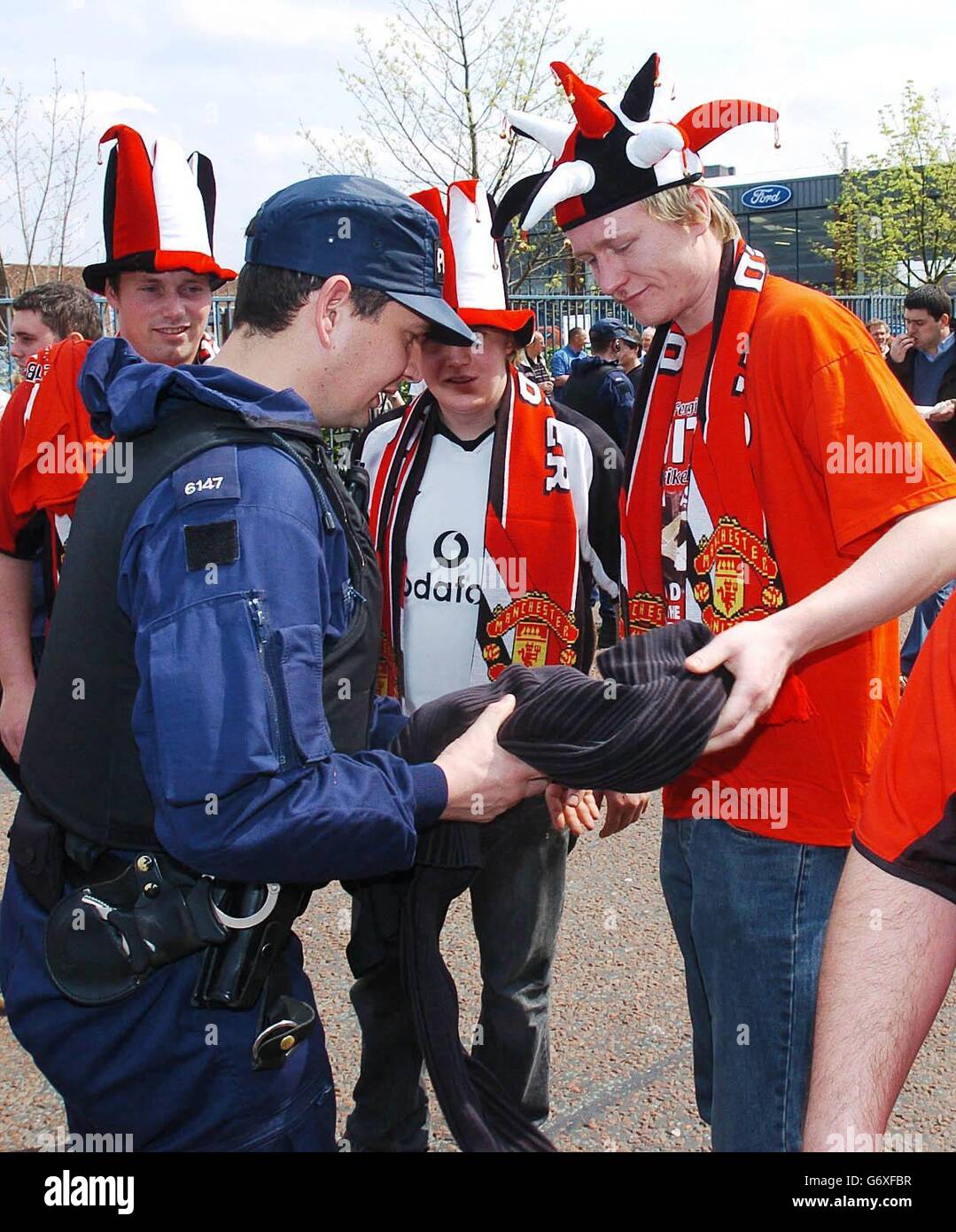 Manchester United fans from Norway are searched by security as they ...