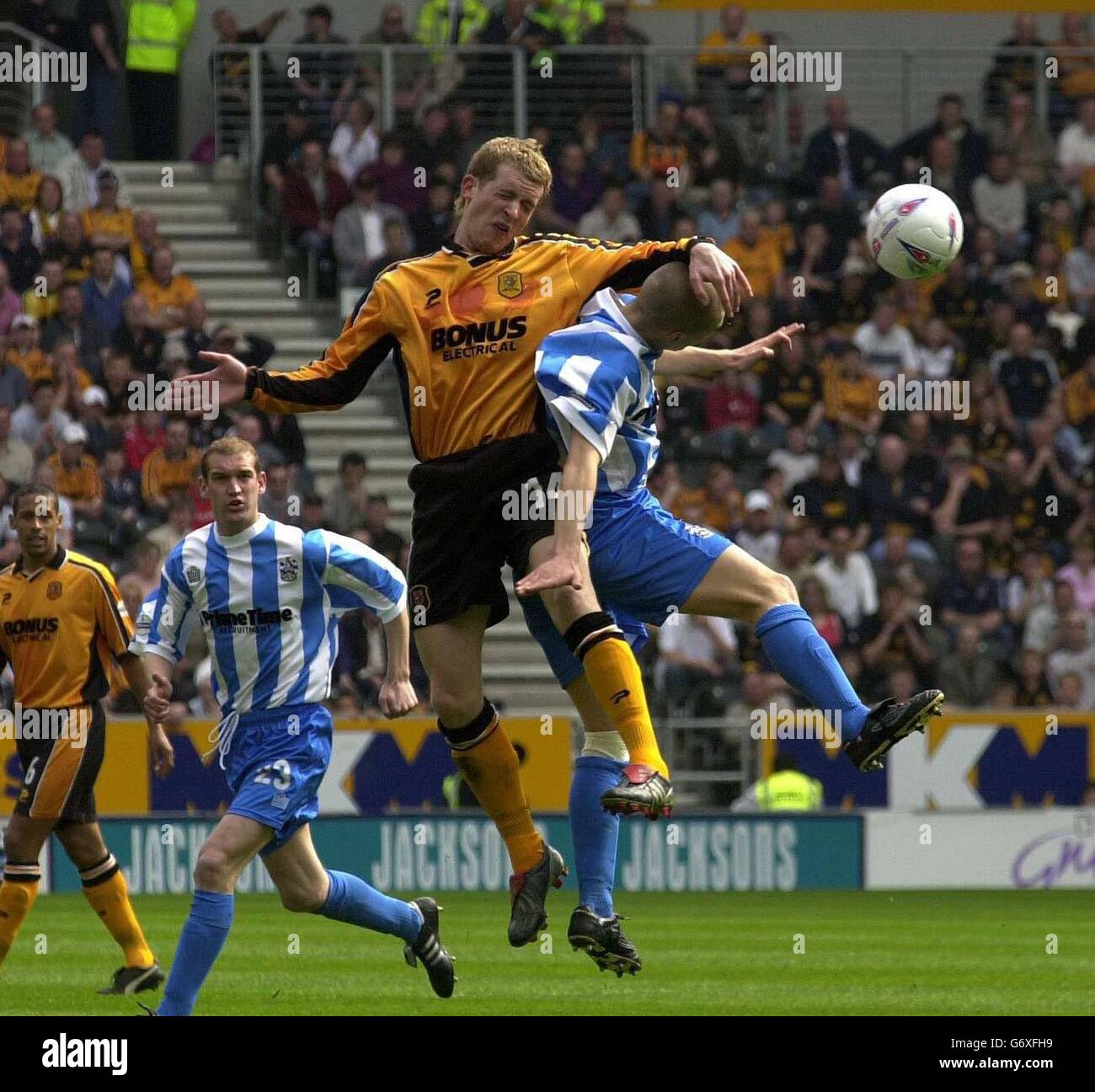 Hull's Stuart Green (left) tangles with Huddersfield's Anthony Lloyd ...