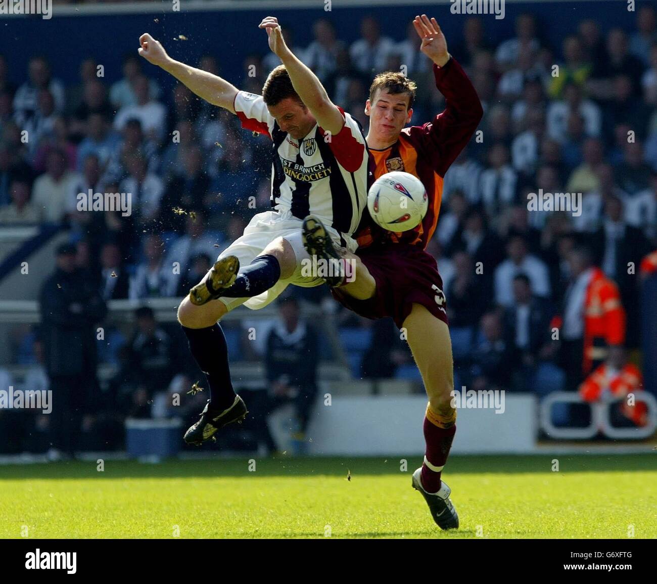 West Bromwich Albion's Mark Kinsella (left) challenges Bradford's Tom ...