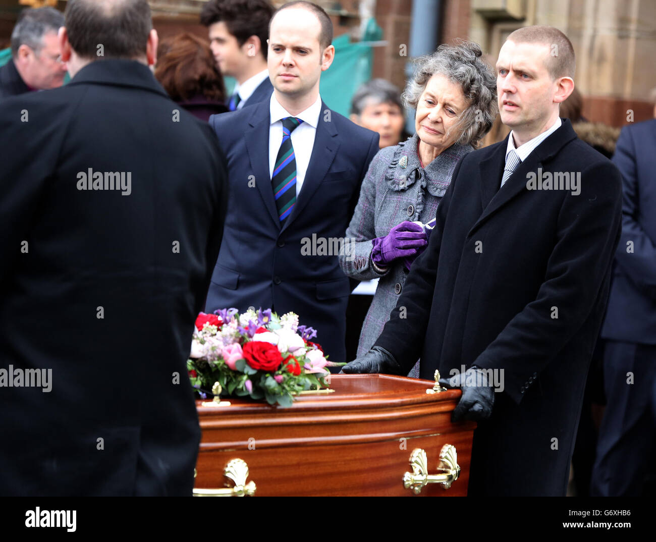 Mourners attend the funeral of Belfast-born actor Jimmy Ellis which ...