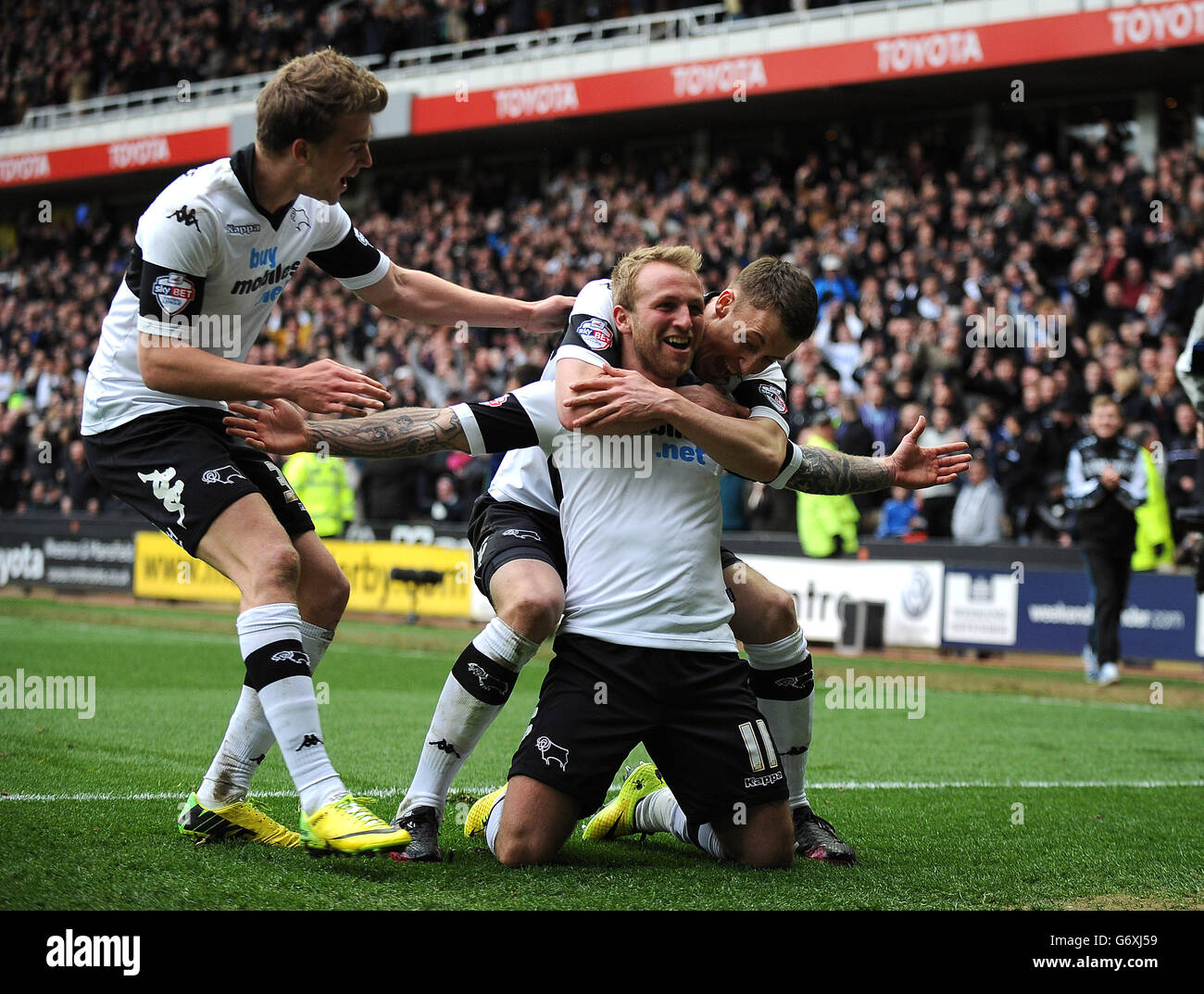Derby County's Johnny Russell (facing) celebrates with Patrick Bamford ...