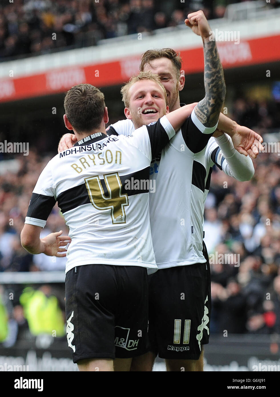 Derby County's Johnny Russell (centre) celebrates with Craig Bryson ...