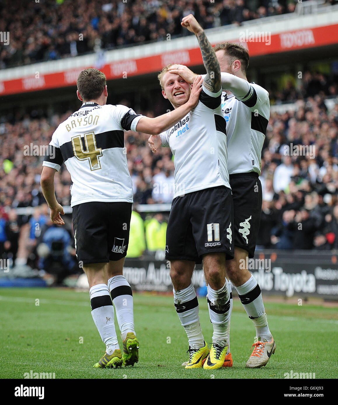 Derby County's Johnny Russell (centre) celebrates with Craig Bryson ...