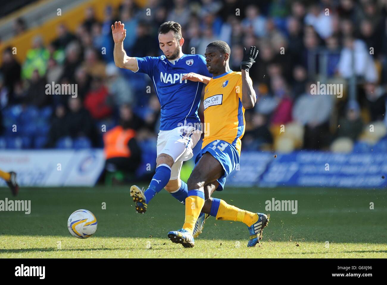 Mansfield Town's Anthony Howell (right) is tackled by Chesterfield's ...