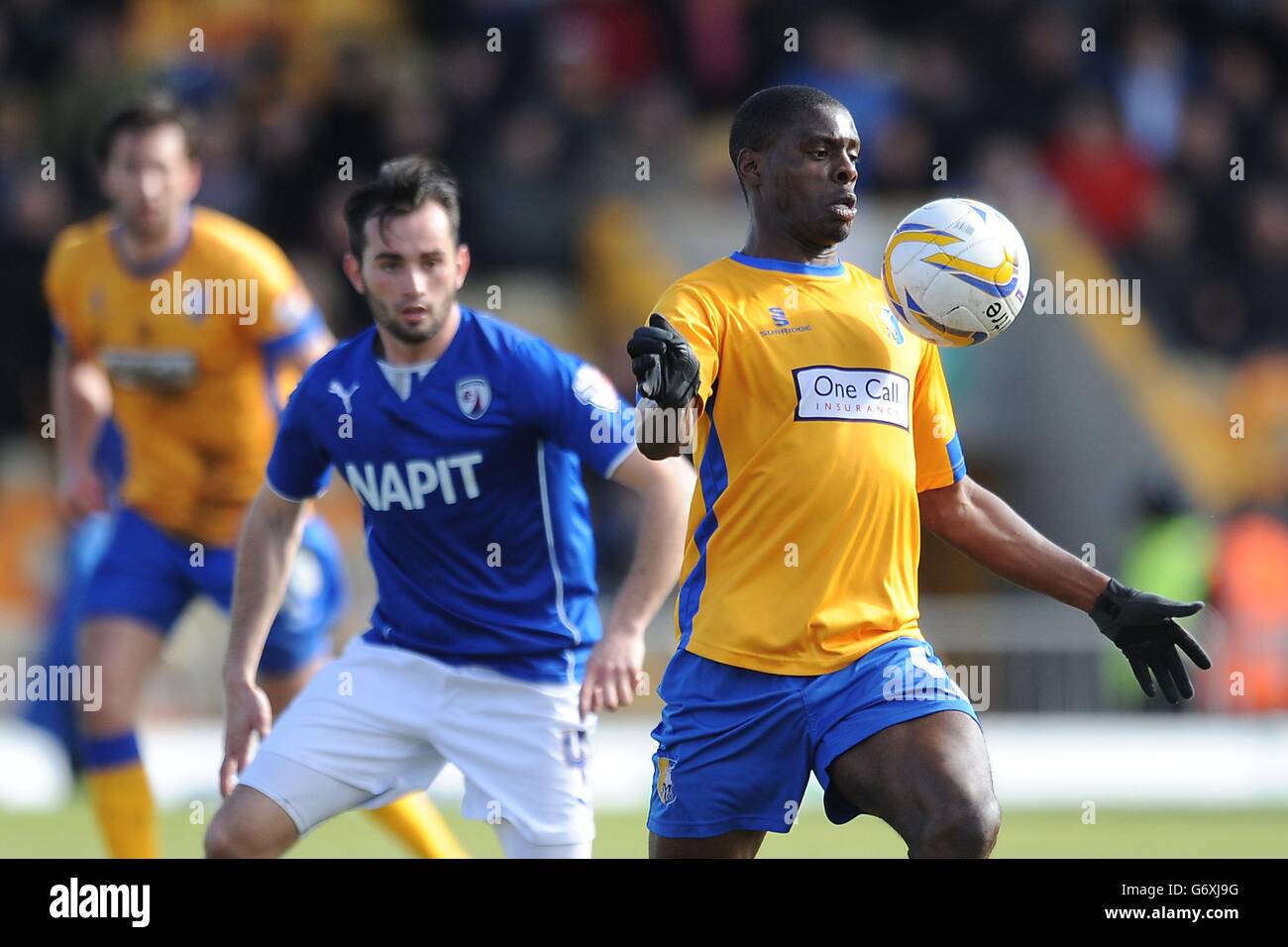 Mansfield Town's Anthony Howell (right) controls the ball under ...