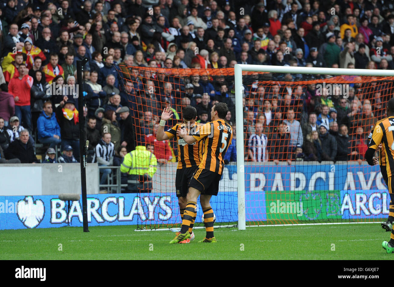 Hull City's Shane Long (left) has a muted celebration in front of the ...