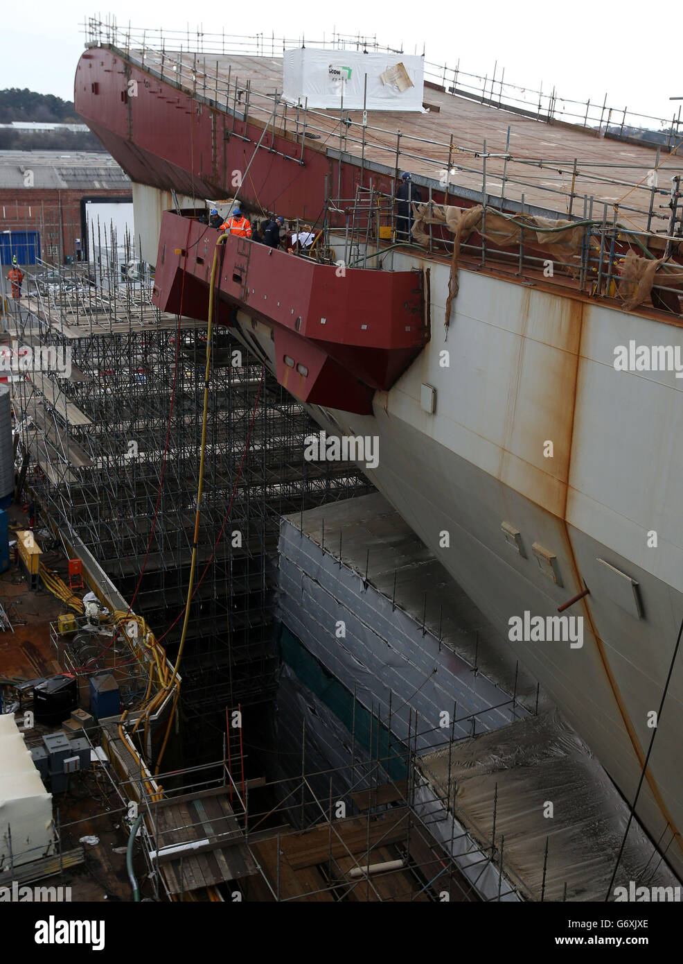 Workman work near the take off ramp on the deck as work continues on ...
