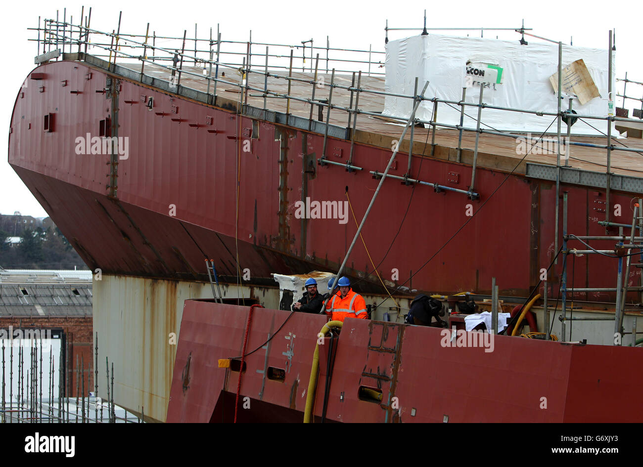 HMS Queen Elizabeth Aircraft Carrier - Rosyth Docks. Workman at work ...